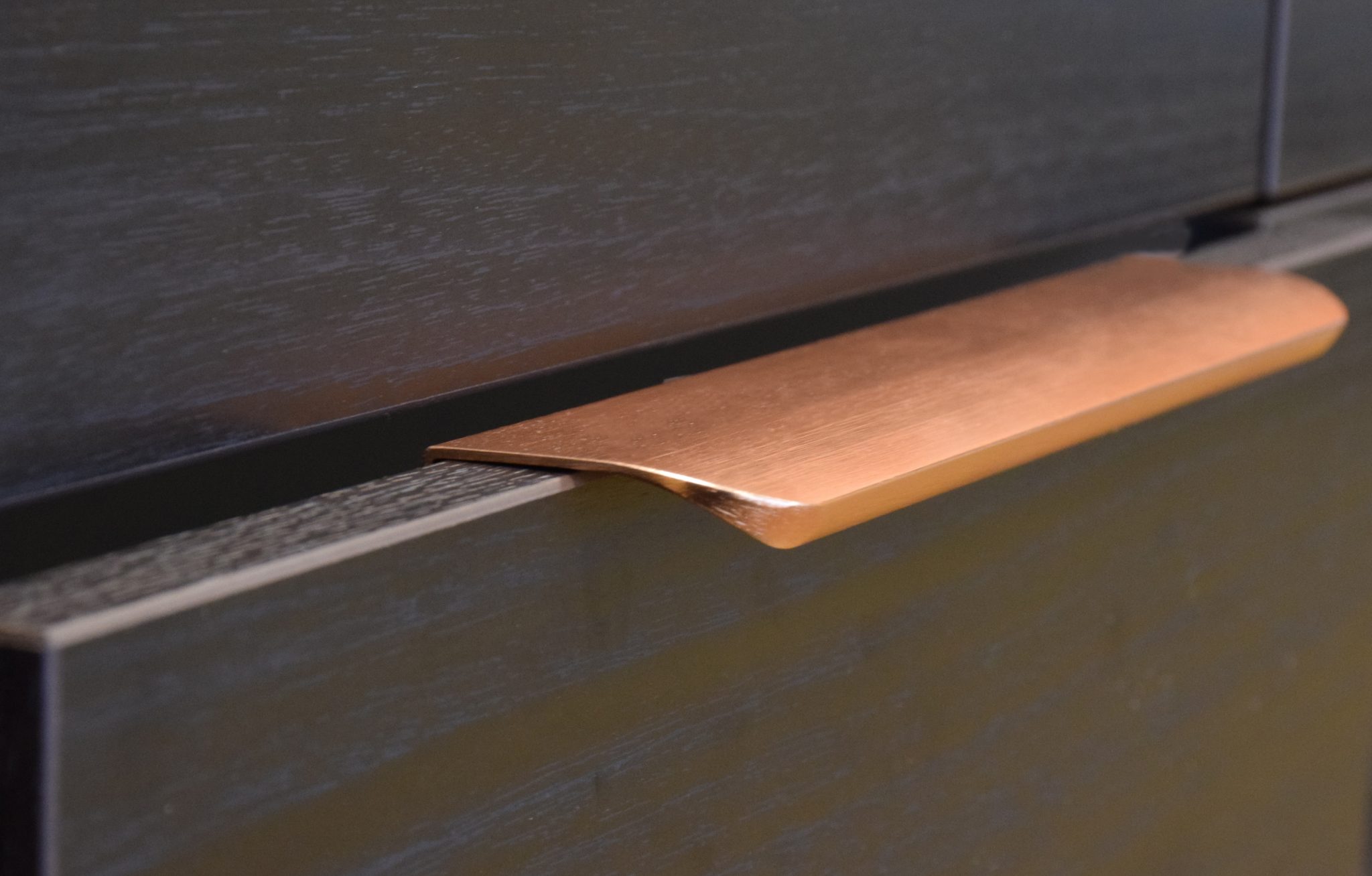 Drawer edge pulls in rose gold anodized aluminum – Wood Industry