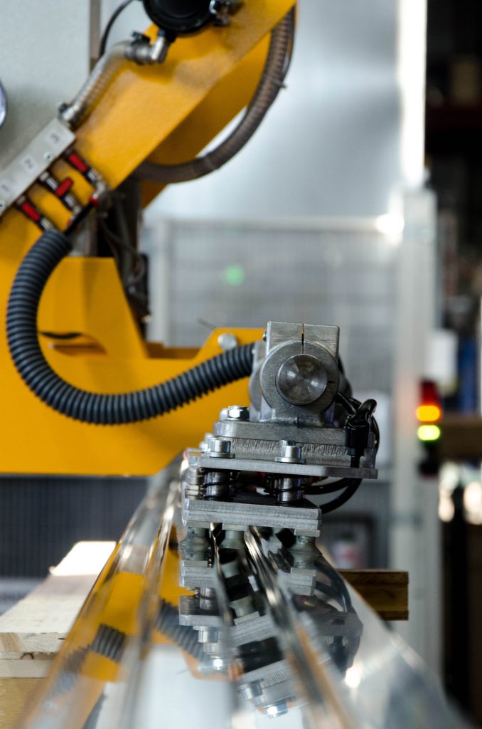 Lifting devices simultaneously pivot and rotate materials – Wood Industry