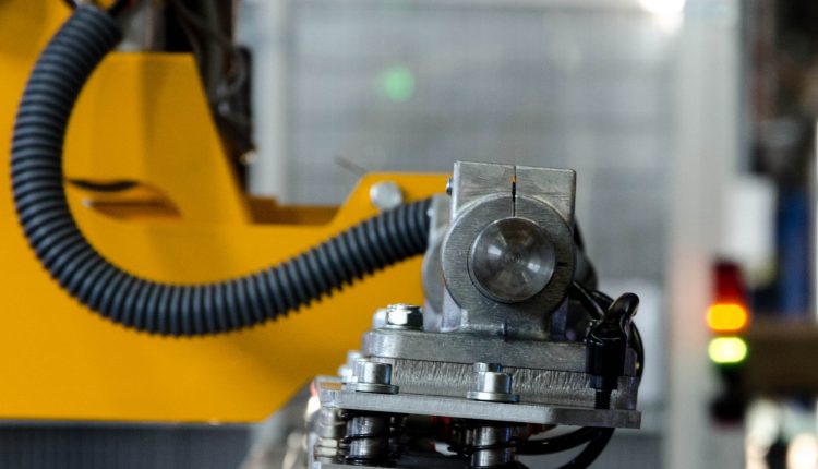 Lifting devices simultaneously pivot and rotate materials – Wood Industry